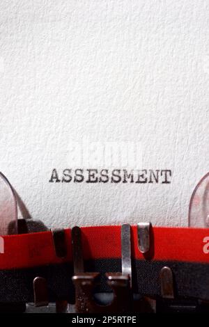 Assessment word written with a typewriter Stock Photo - Alamy