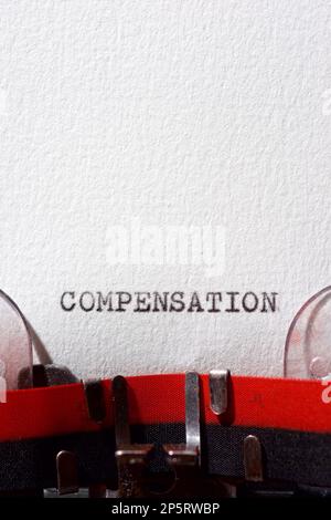 Compensation word written with a typewriter Stock Photo - Alamy