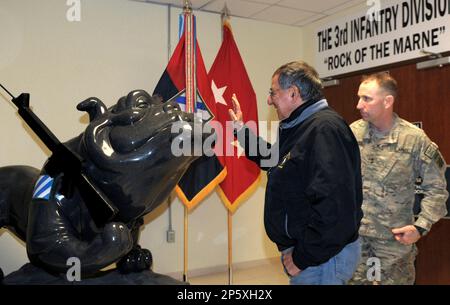 Rocky, the 3rd Infantry Division mascot, poses with a statue of himself ...