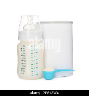 Blank can of powdered infant formula with feeding bottle and scoop on ...