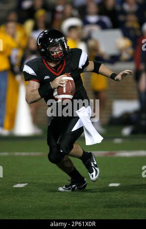 Cincinnati quarterback Ben Mauk runs upfield against West Virginia in ...
