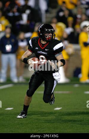 Cincinnati quarterback Ben Mauk runs upfield against West Virginia in ...