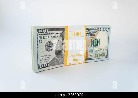 10,000 dollars packed in a bundle on a black background. Business ...