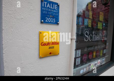 Picture of a sign with the logo of Gault et Millau guide in front of a ...
