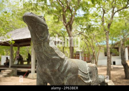 Komodo dragon lying on the sand of a zoo enclosure Stock Photo - Alamy