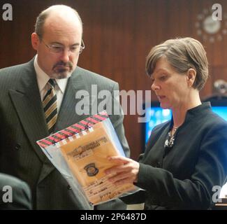 Chief Assistant Prosecutor Jeff Stroud uses aerial photos to describe ...