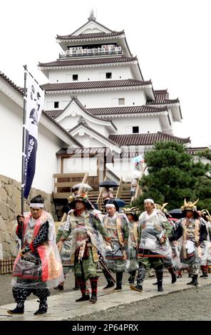 Parade participants, clad in samurai costumes, start their procession ...