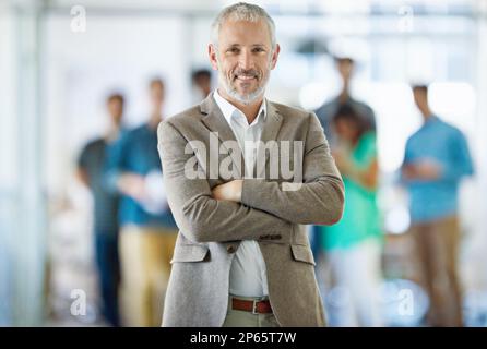 Behind every successful man. Handsome man reading while his wife ...