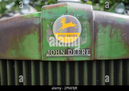 John Deere badge on tractor grill Stock Photo - Alamy