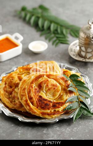 Roti Parata or Roti Canai with Chicken Curry Sauce, Popular Malaysian ...