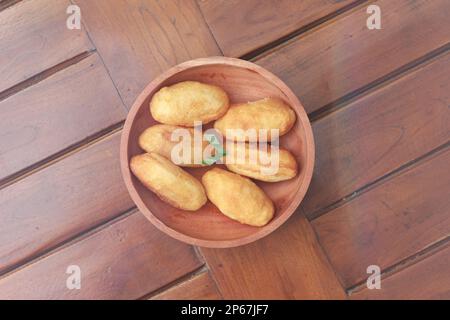 Comro or combro, a traditional Javanese snack made of deep fried grated ...