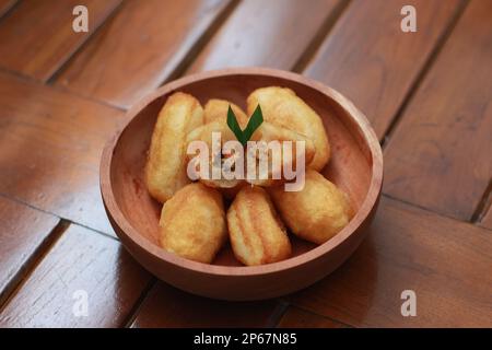 Comro or combro, a traditional Javanese snack made of deep fried grated ...