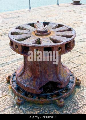 Rusty Capstan on a Harbour Quayside Stock Photo - Alamy