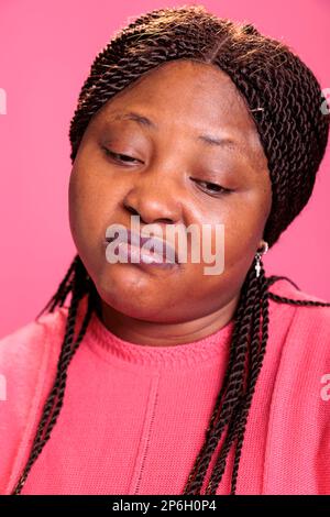Young woman with disgusted expression repulsing something, isolated on ...