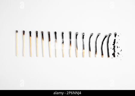 Different stages of burnt matches on blue background, flat lay Stock ...