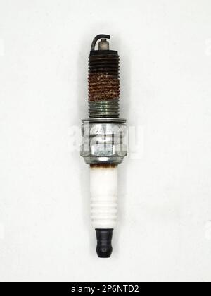 Old used spark plug isolated on white background Stock Photo - Alamy