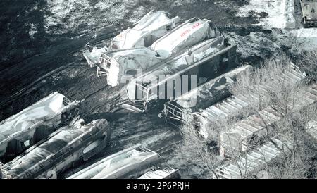 Destroyed rail cars and debris wait Monday, Jan. 21, 2002, in Minot, N ...