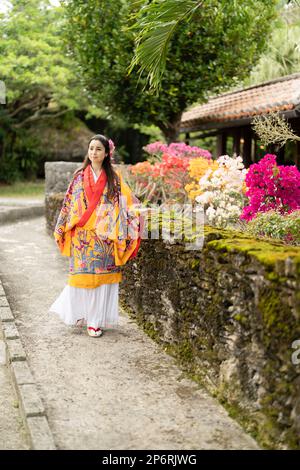 Woman wearing Uchinaasugai, Ryusou, Ryuso, traditional dress of Ryukyu ...