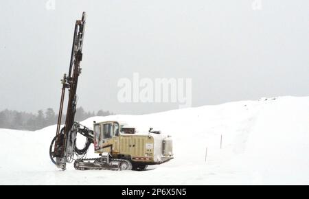 Drilling holes for dynamite blasting Stock Photo - Alamy