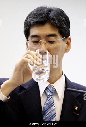 Yasuhiro Sonoda, a lawmaker drinks a glaas of decontaminated water ...