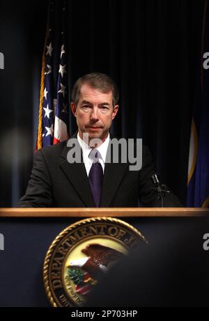 Assistant U.S. Attorney Jeffrey Paulsen, left, speaks during a news ...