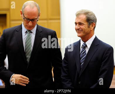 Attorney Larry Ginsberg, left, and actor Mel Gibson appear in a Los ...