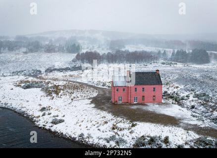 Aerial views of Culzie Lodge also known as The Pink House in snow on ...