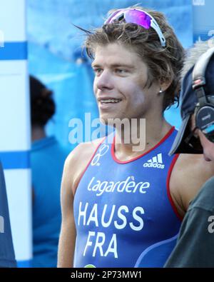 David Hauss, of France, who placed 3rd, after crossing the finish line ...