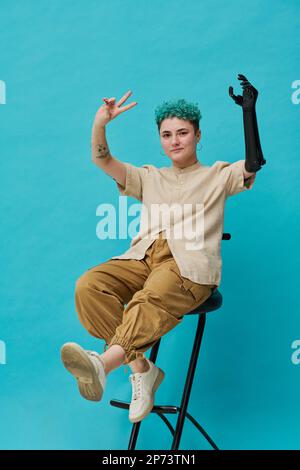 Teenage Girl with Prosthetic Hand Sitting and Talking Stock Photo - Alamy