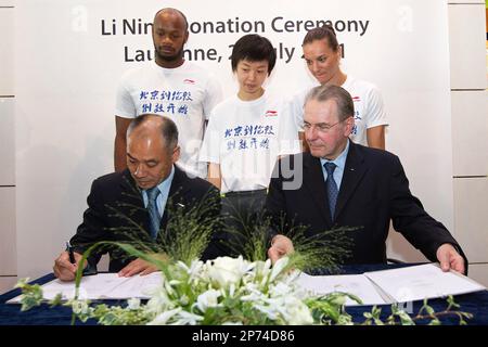 Li Ning, left, Chinese former Olympic gymnastics champion and founder ...
