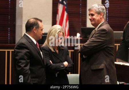 Assistant state attorneys Frank George, left, talks to Linda Drane ...