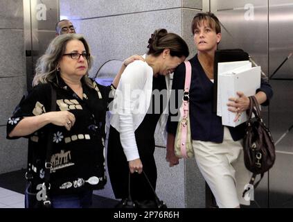 Dalia Dippolito's mother, Randa Mohammed, watches at Dalia, who hired a ...