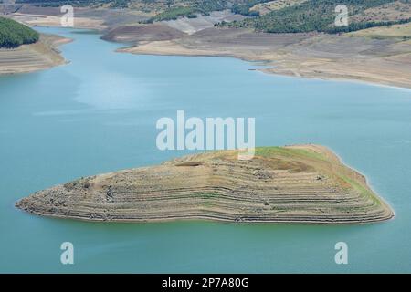Little water in the Fierza reservoir with dry shore, near Kukes ...