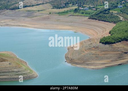 Little water in the Fierza reservoir with dry shore, near Kukes ...