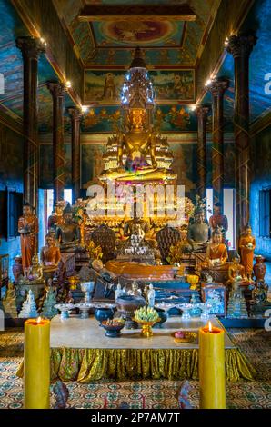 Statues within the main alter at the ancient buddhist Wat Phnom in ...