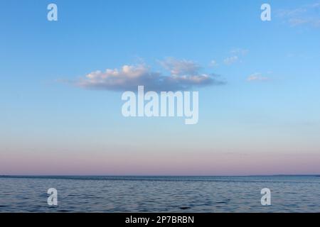Once there were only one cloud in the sky. Sky in nightfall and ocean ...