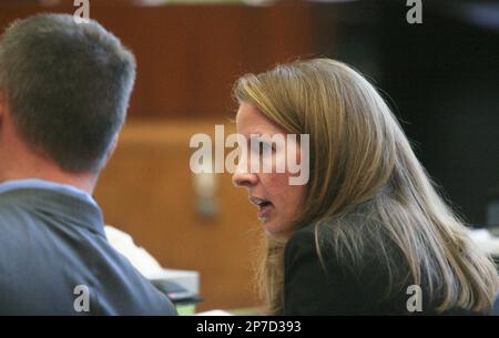 Deputy District Attorneys Matt Kemmy, from left, Katie Suver and ...