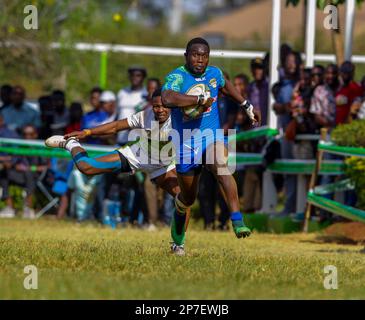 Beldad Ogeta of Menengai Oilers (blue) and Samuel Asati of KCB during ...