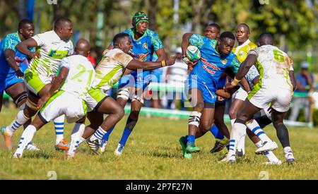 Beldad Ogeta of Menengai Oilers (blue) and Samuel Asati of KCB during ...