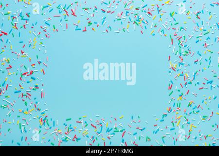 greeting wreath of colorful sprinkles blue background, festive ...