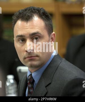Seattle Police Officer Benjamin L. Kelly shows the jury how Maurice ...
