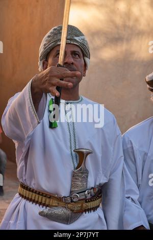 Traditional Omani sword dance in Nizwa fort, Oman Stock Photo - Alamy