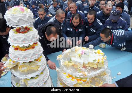 Inmates enjoy birthday cakes during a mass birthday party for inmates ...