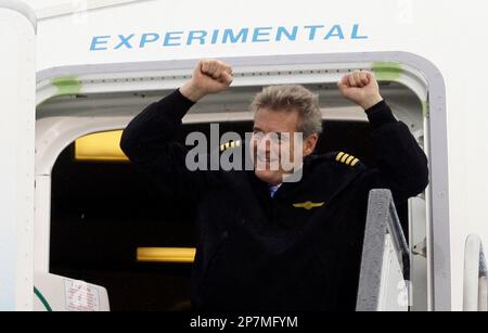 Boeing 787 Chief Pilot Mike Carriker celebrates from the flight deck ...