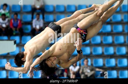 Bryan Nickson Lomas, right, and Yeoh Ken Nee of Malaysia compete during ...
