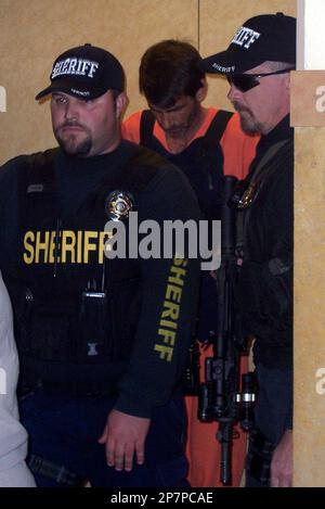 James Kraig Kahler, center, arrives for his first court appearance on a ...