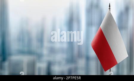 Small flags of the Poland on an abstract blurry background Stock Photo ...