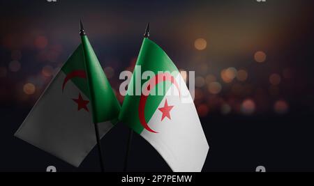 Small flags of the Algeria on an abstract blurry background Stock Photo ...