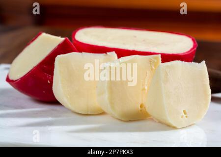 British red waxed original cheddar cheese madse from cow milk close up ...