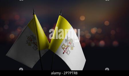 A small Vatican flag on an abstract blurry background Stock Photo - Alamy